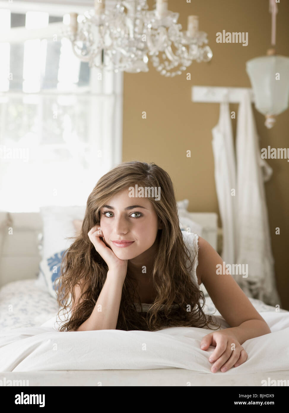 young woman lying on her bed Stock Photo - Alamy