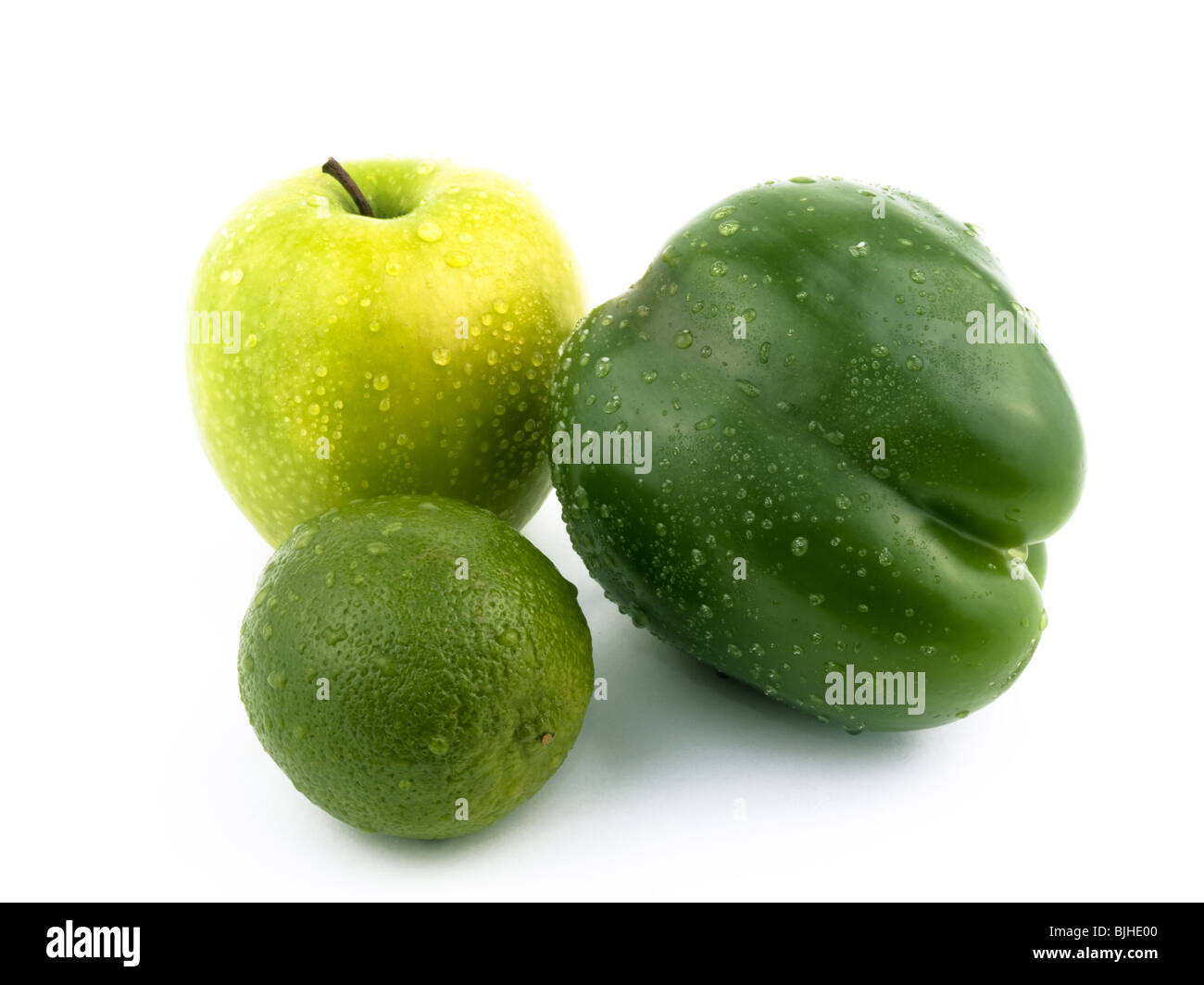 Green apple, paprika and lime on white background Stock Photo - Alamy