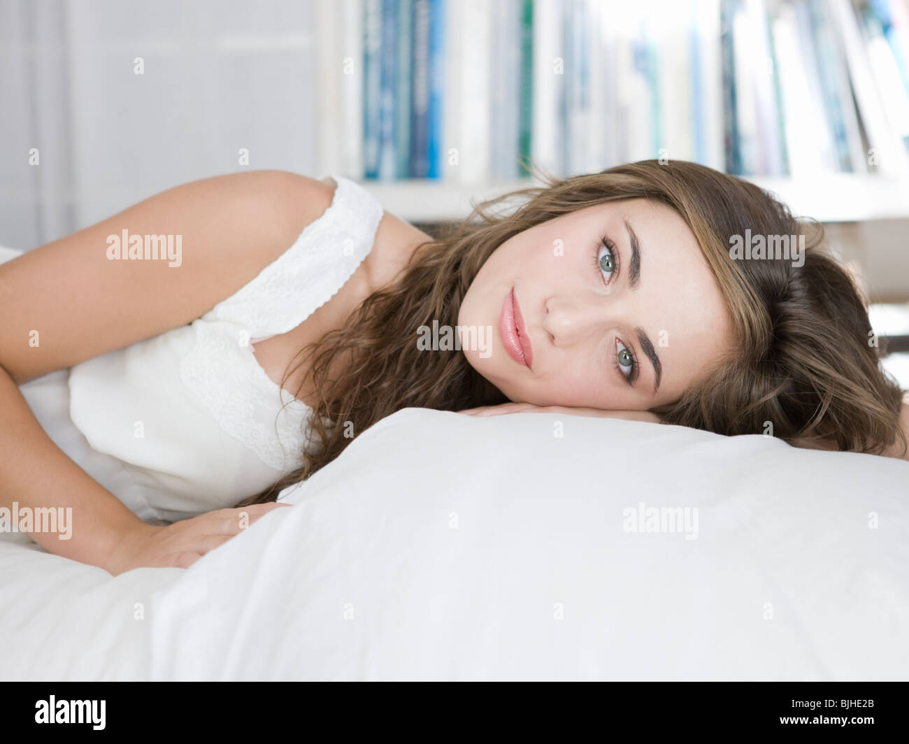 young woman lying on her bed Stock Photo - Alamy