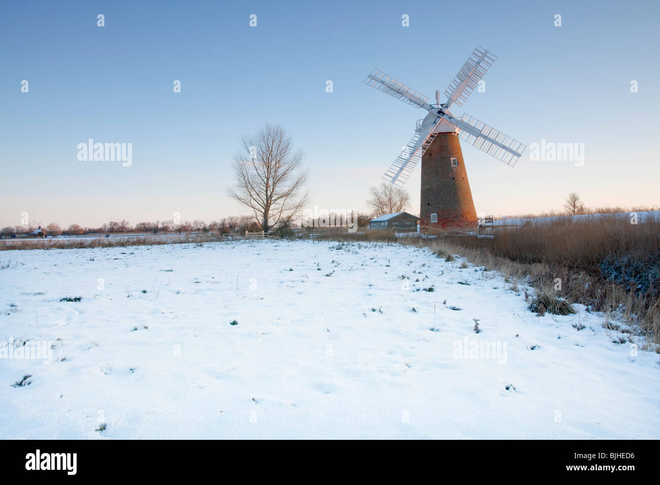 The Leaning Hardley Drainage Mill at first light following winter ...
