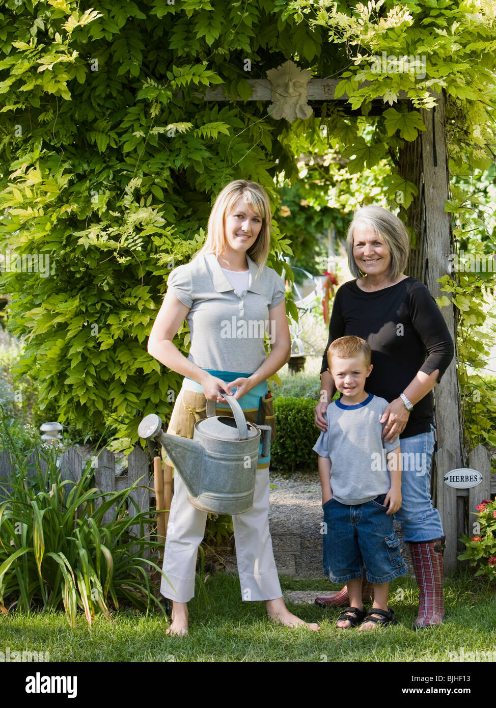 three generation family in the garden Stock Photo - Alamy