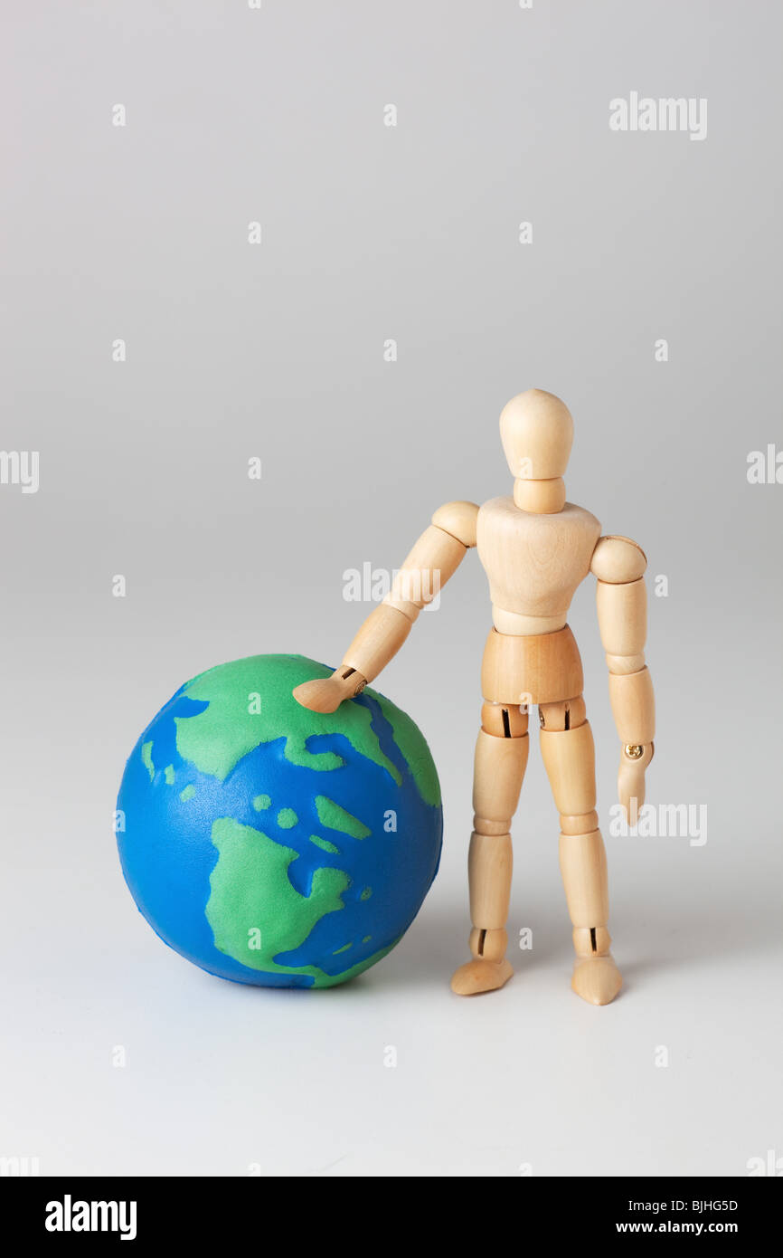 mannequin with toy earth Stock Photo - Alamy