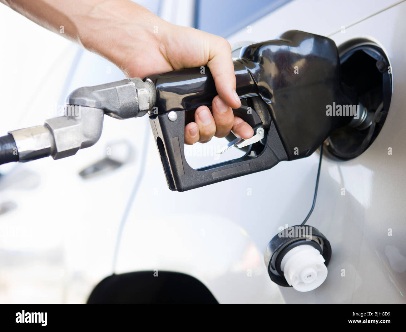 hand pumping gas into a car Stock Photo - Alamy