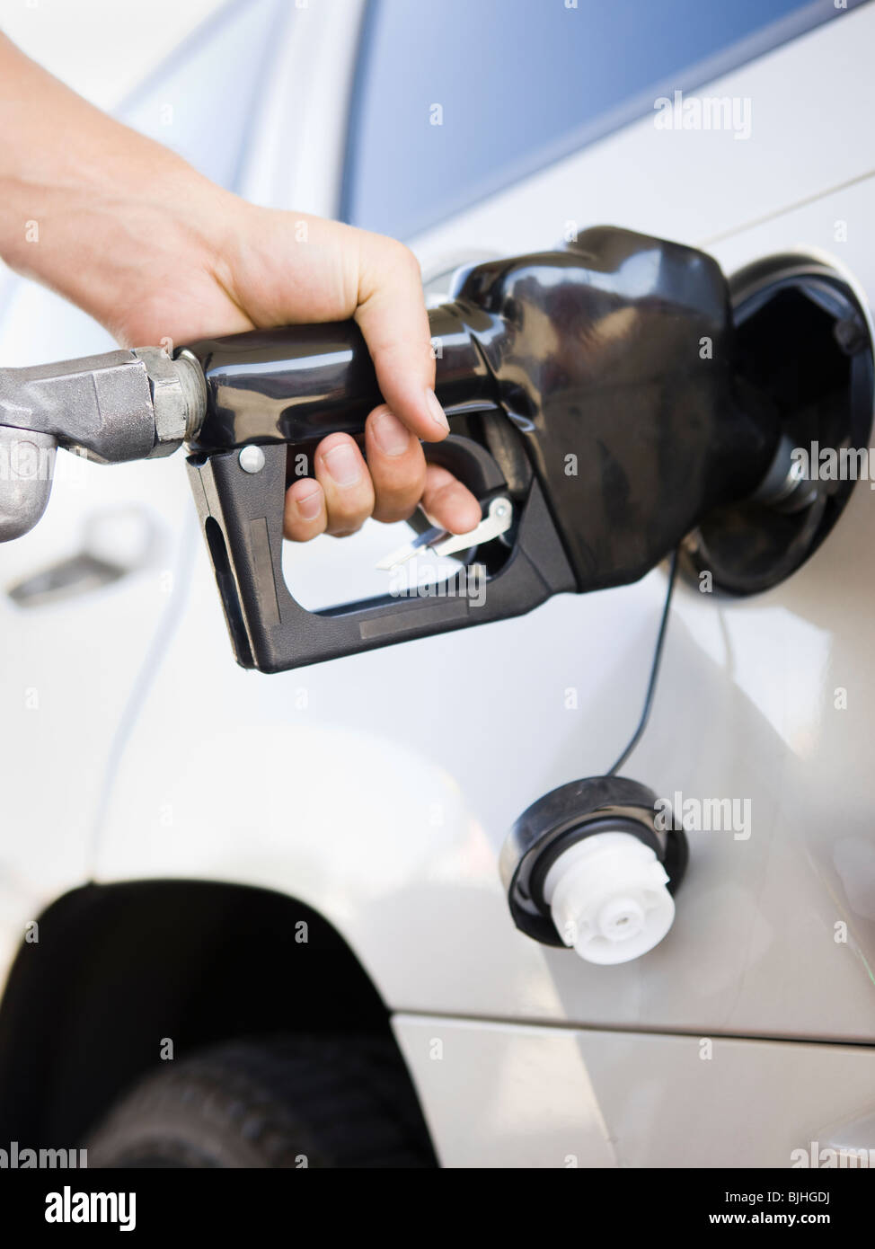 hand pumping gas into a car Stock Photo - Alamy