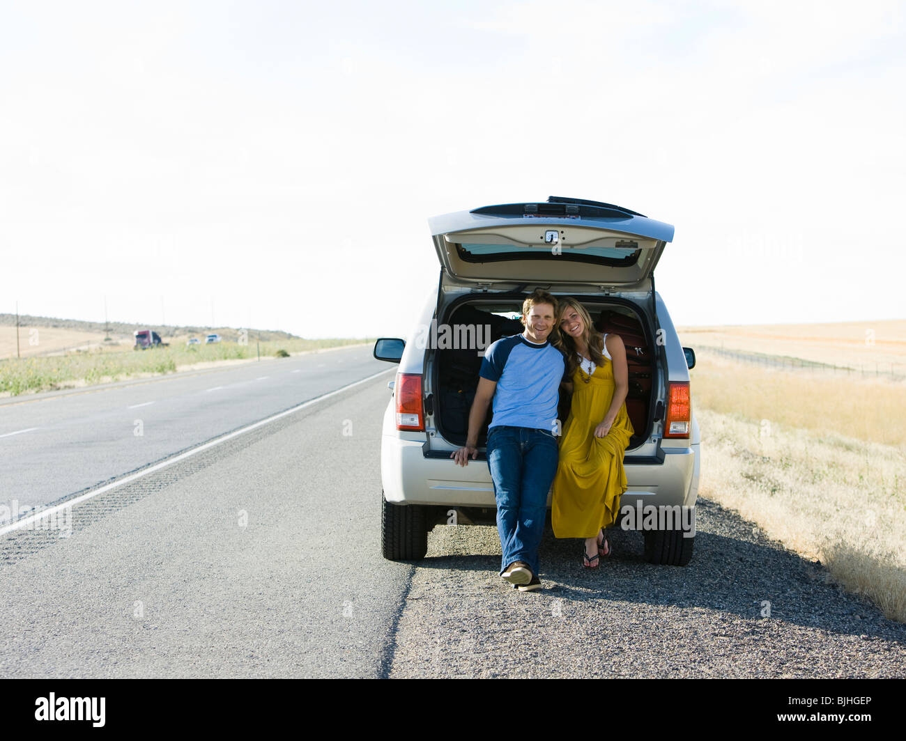 Couple sitting on tailgate car hi-res stock photography and images - Alamy