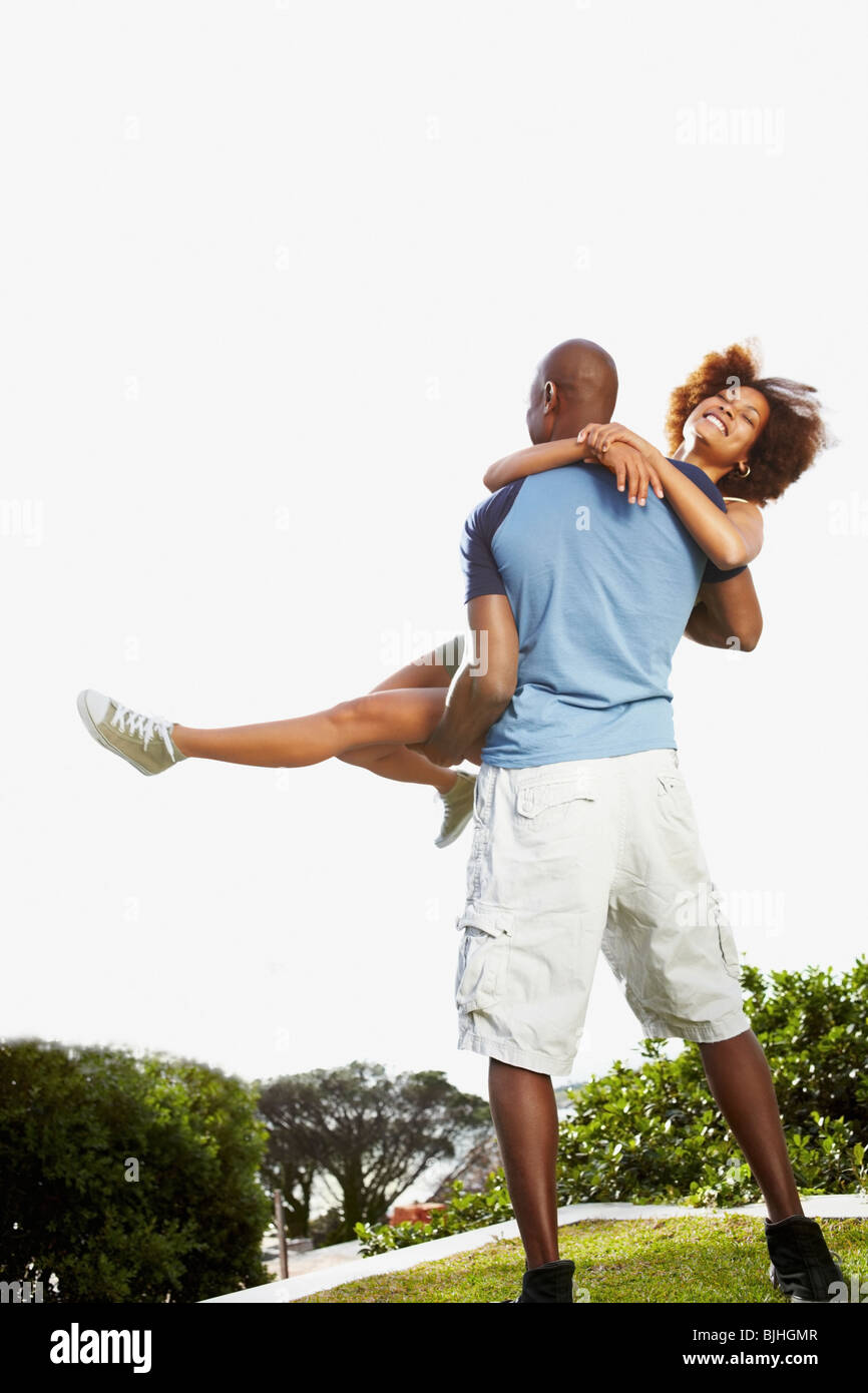 Man carrying woman Stock Photo - Alamy