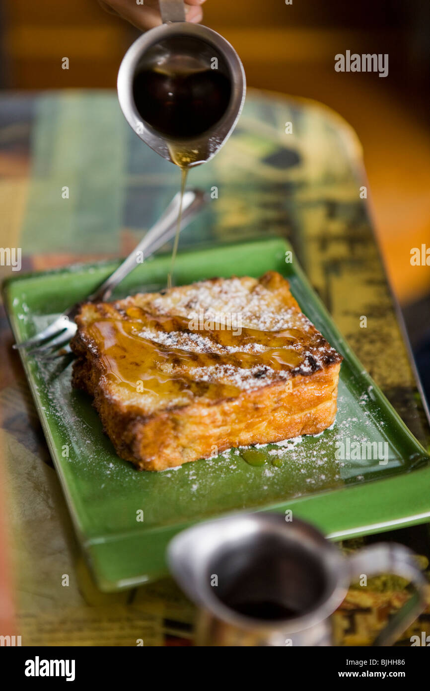 pouring syrup on french toast Stock Photo - Alamy