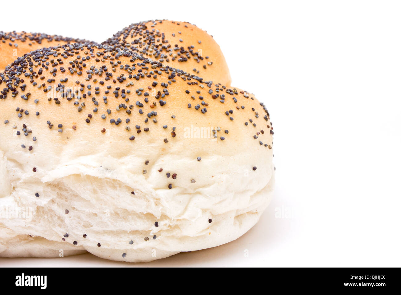 Seeded bread roll from low viewpoint isolated against white background ...