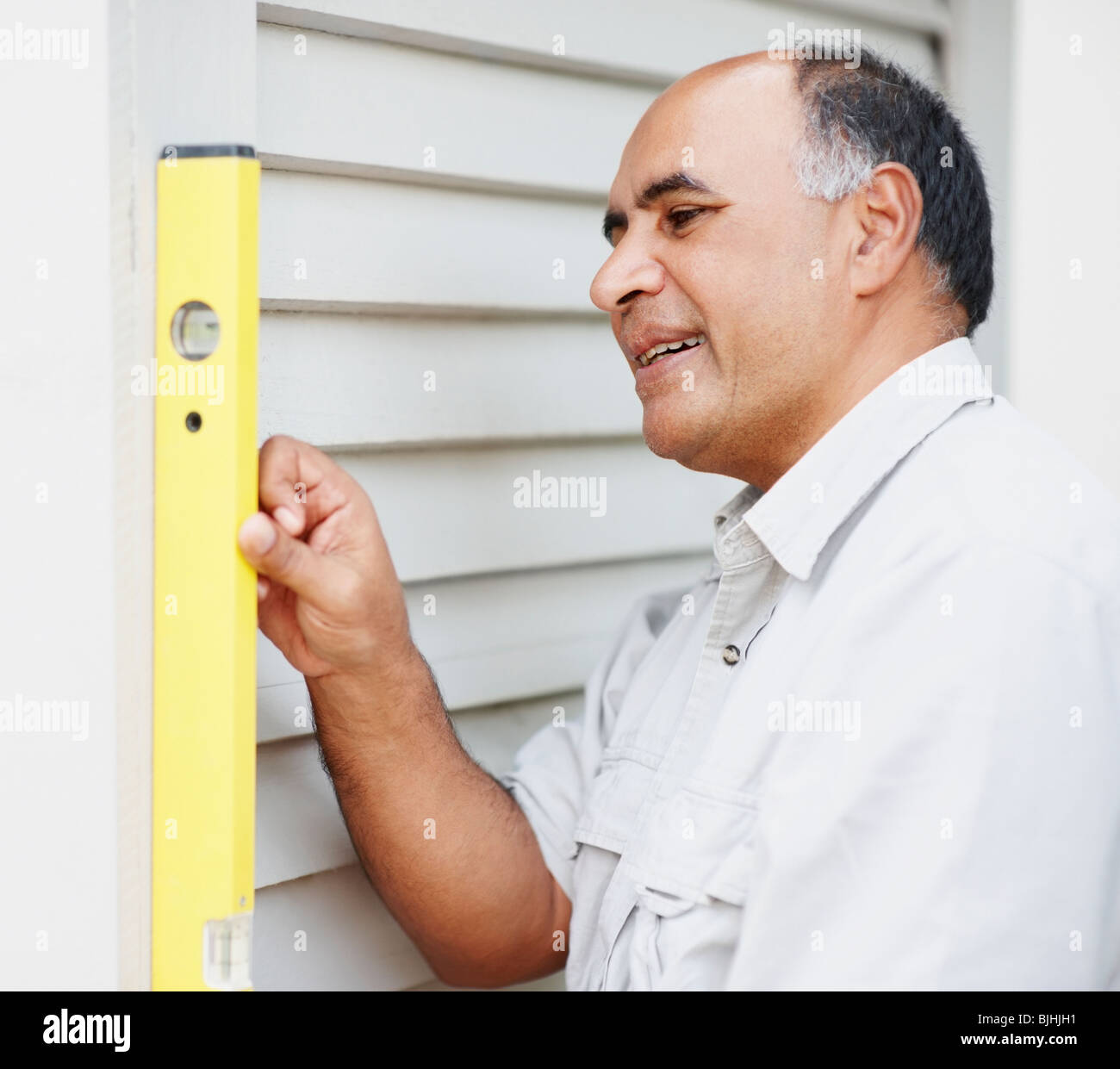 Man using level Stock Photo - Alamy