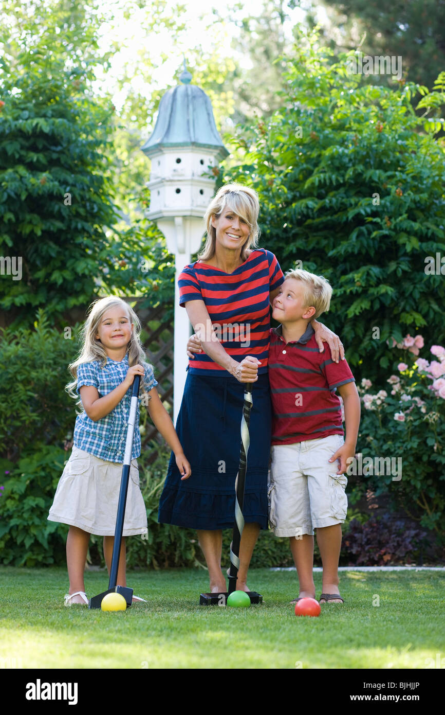 family playing croquet in the backyard Stock Photo - Alamy