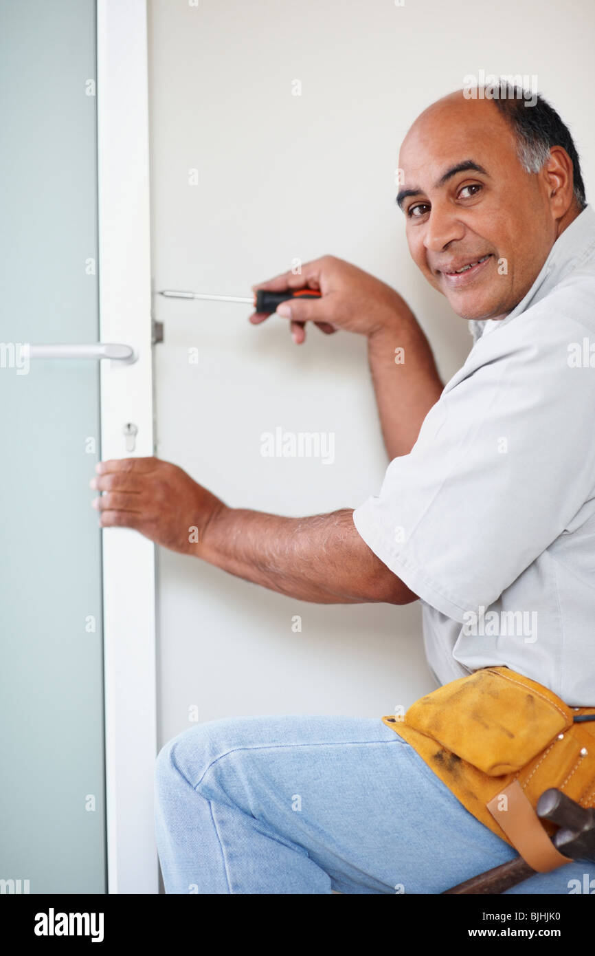 Handyman repairs interior doors hi-res stock photography and images - Alamy
