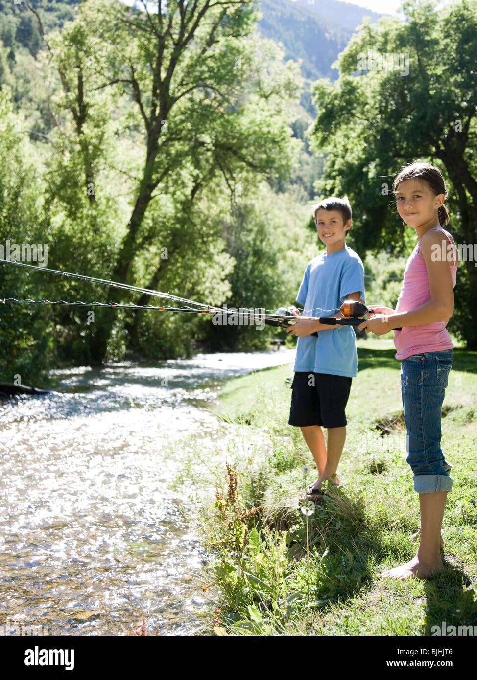 brother and sister fishing Stock Photo - Alamy