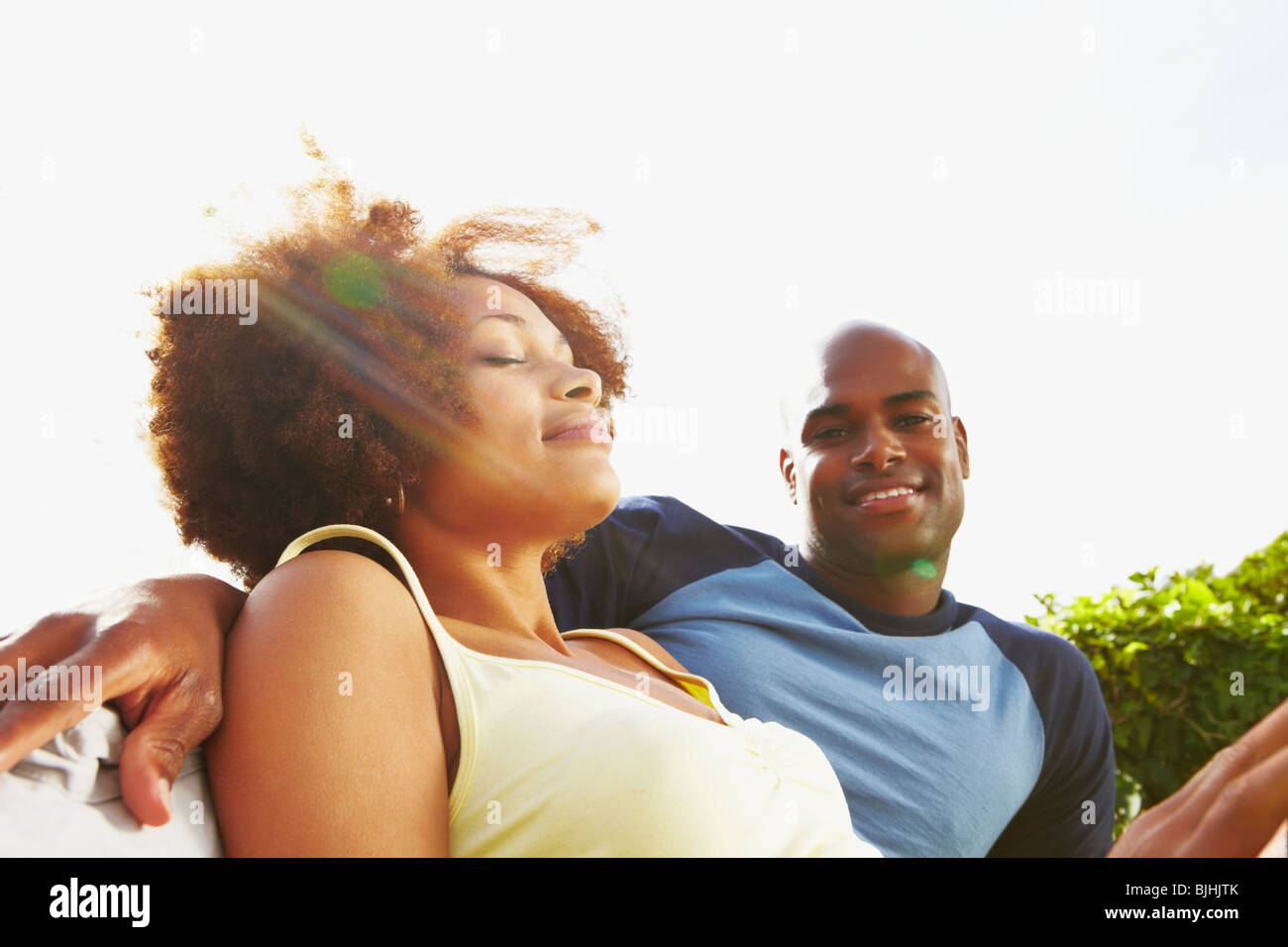 Couple relaxing outside Stock Photo - Alamy