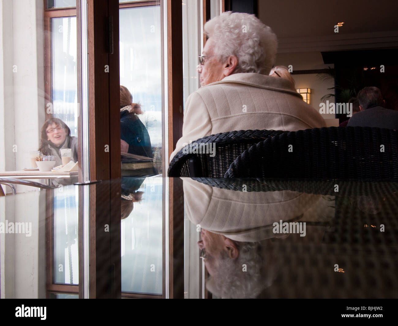 Old Lady Looking Out of Window Stock Photo - Alamy