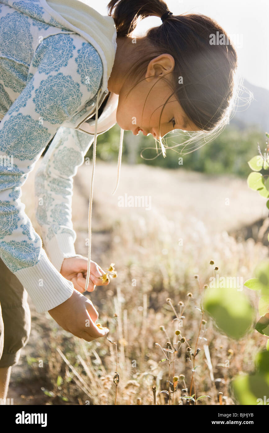 Girl picking wildflowers hi-res stock photography and images - Alamy