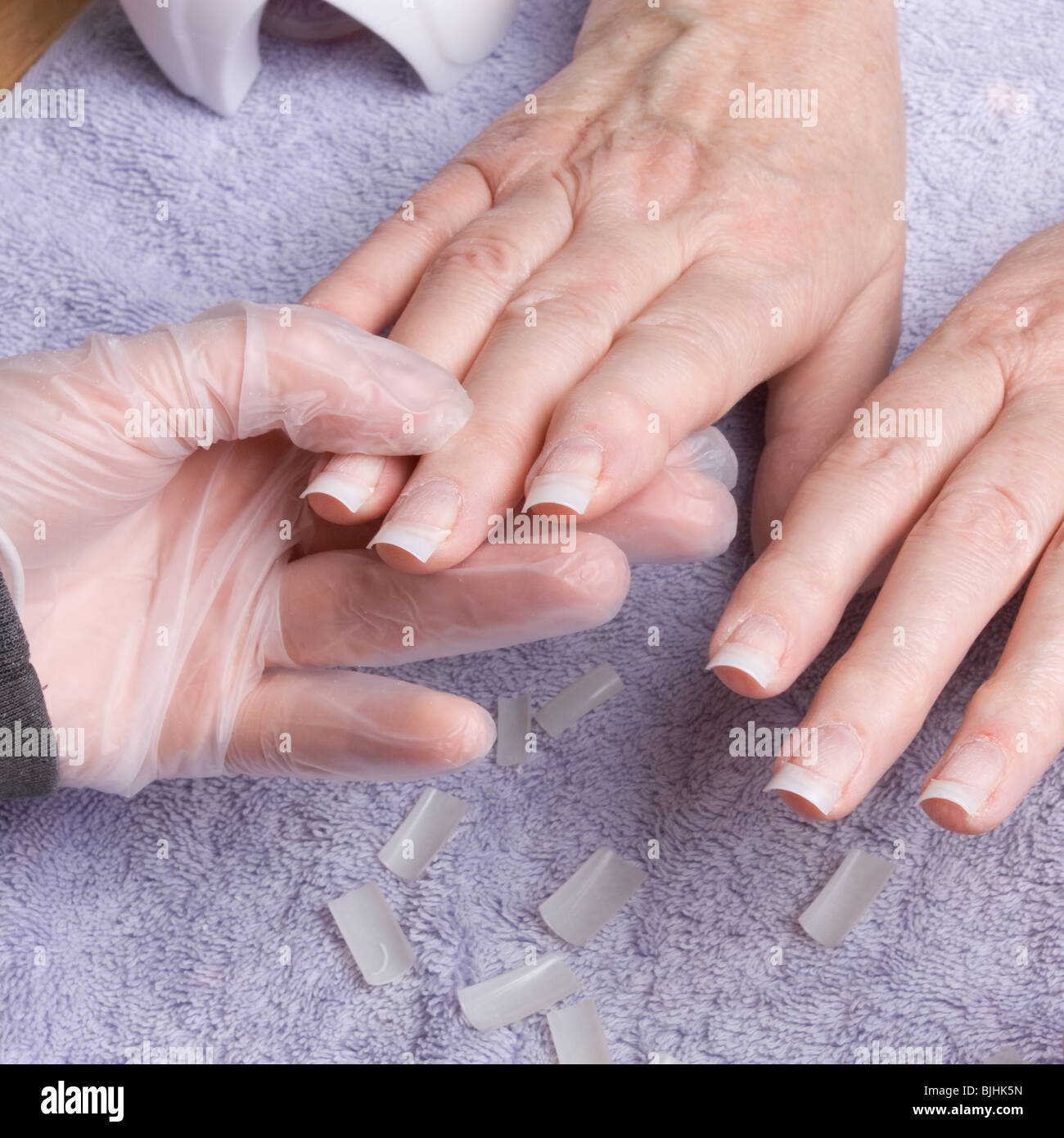 Older senior womans hand receiving home spa/beauty treatment of nail ...