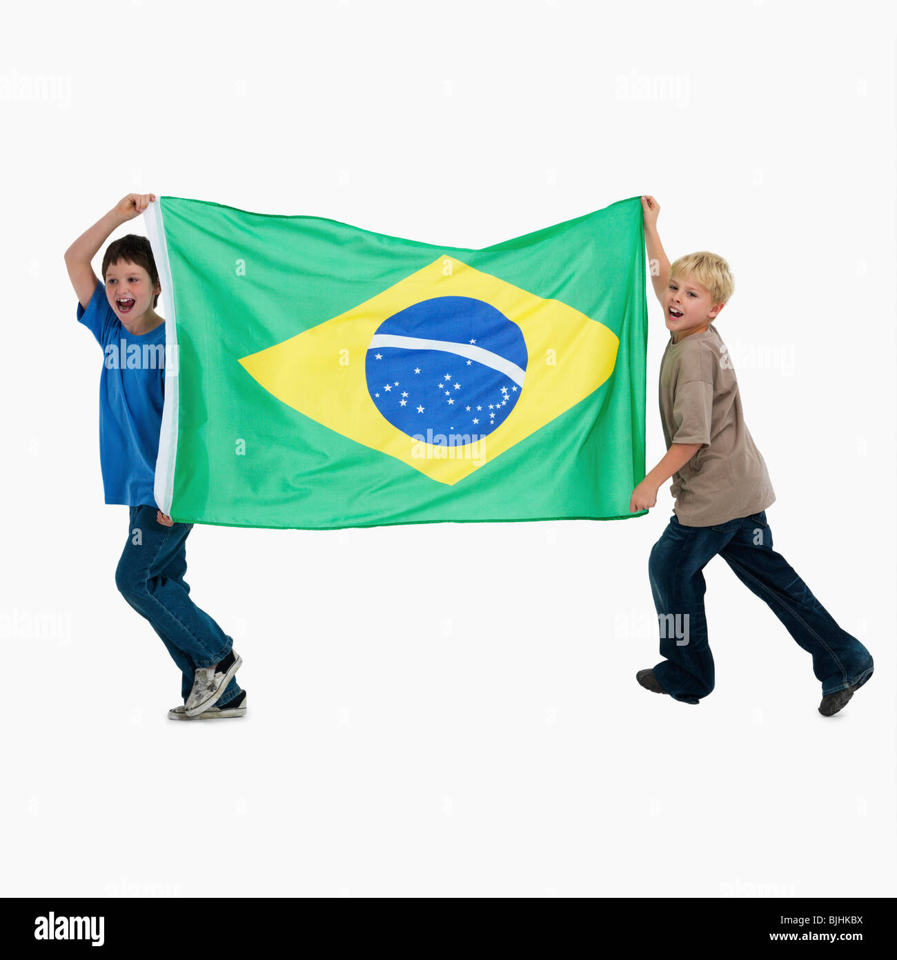 Two boys carrying flag Stock Photo - Alamy