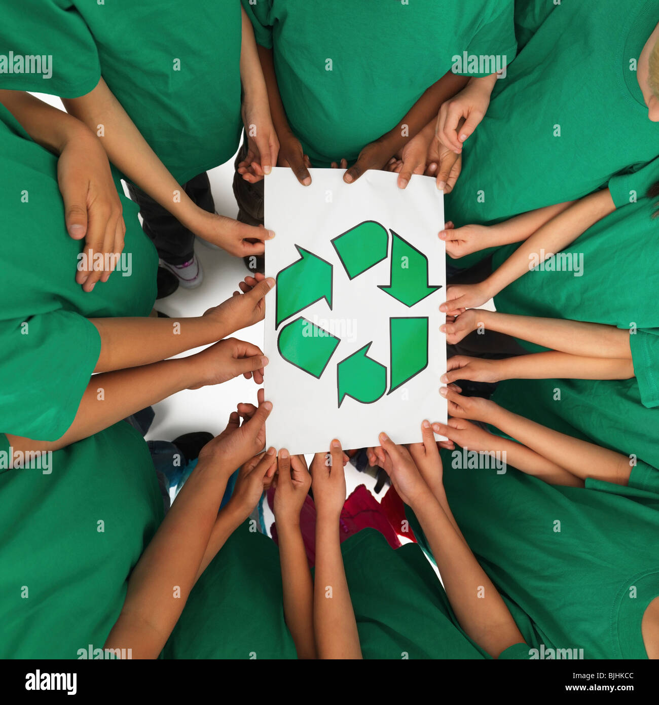 Children holding recycling sign Stock Photo - Alamy