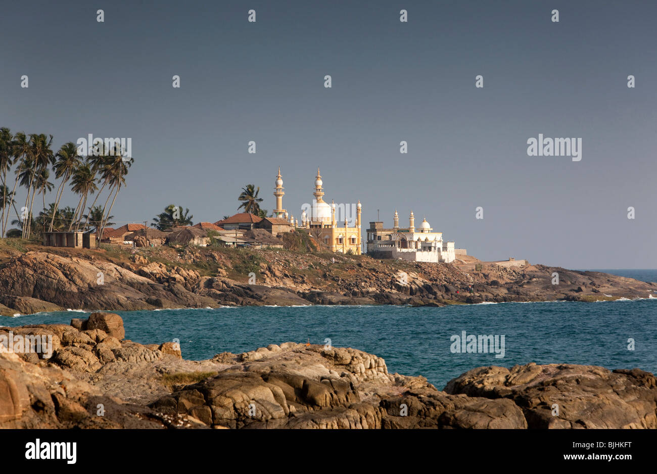 India, Kerala, Kovalam, Vizhinjam village mosques across the bay from ...