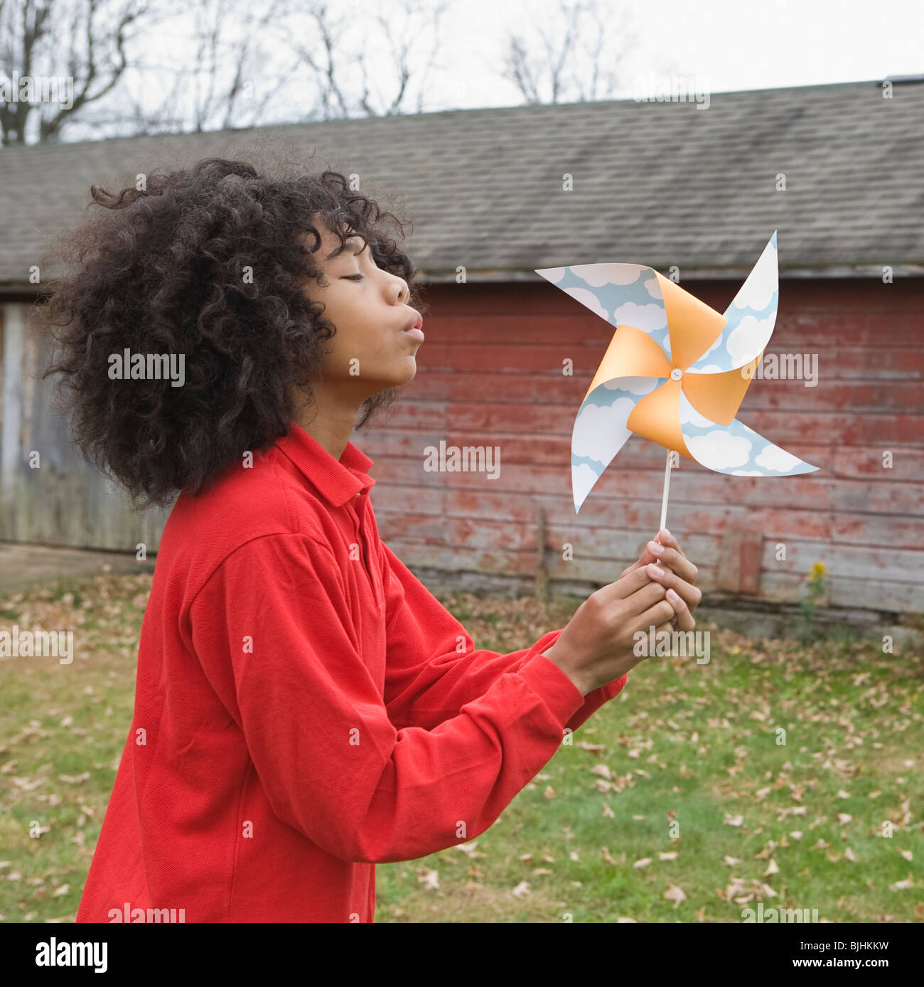 Girl blowing toy windmill Stock Photo - Alamy Girl blowing toy windmill Stock Photo - Alamy