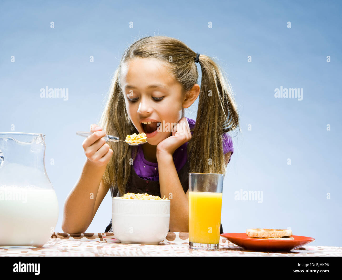 girl eating a complete breakfast Stock Photo - Alamy