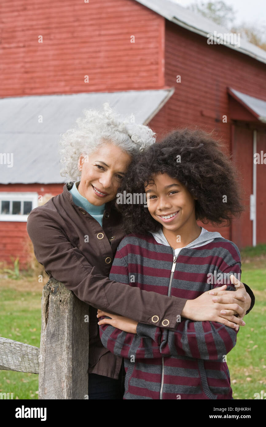 Woman embracing child Stock Photo - Alamy