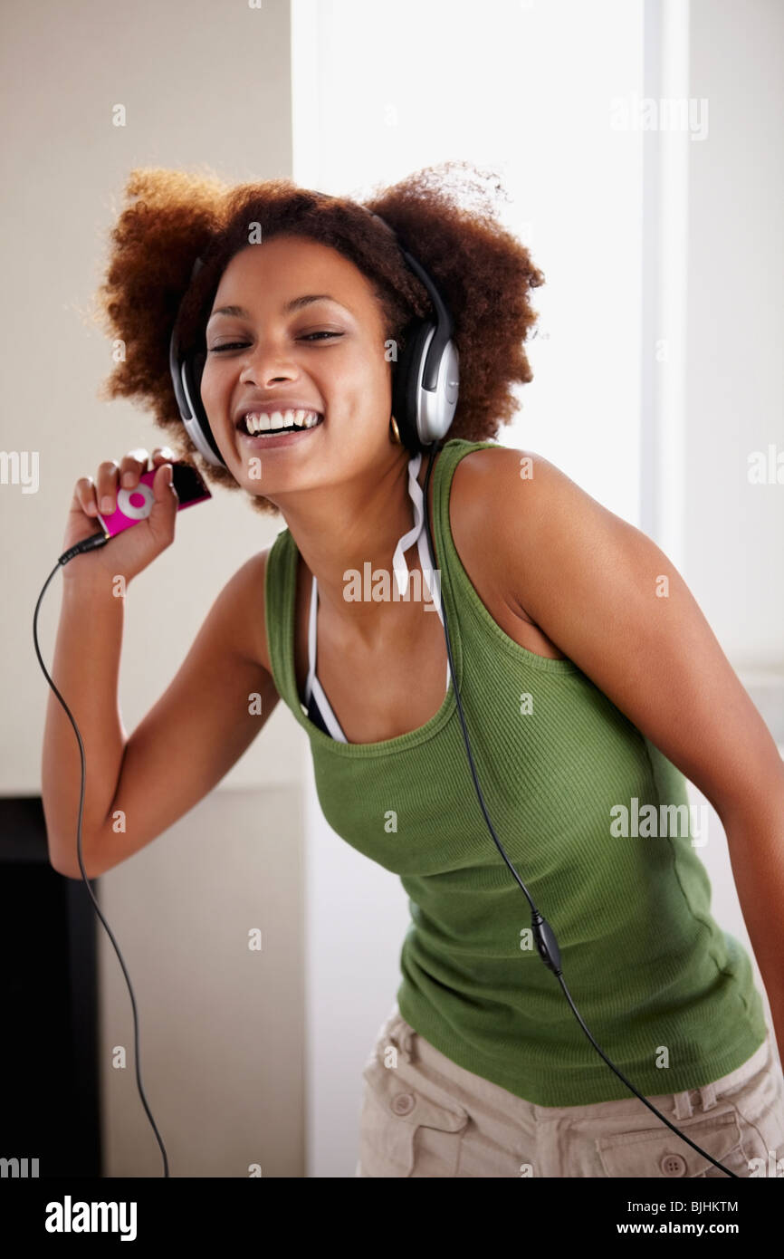 Woman listening to music Stock Photo - Alamy