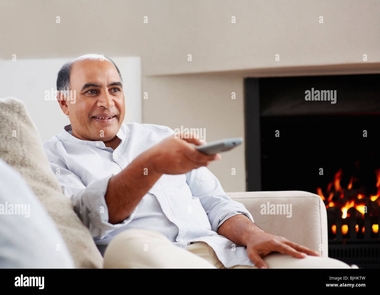 Man watching television Stock Photo - Alamy