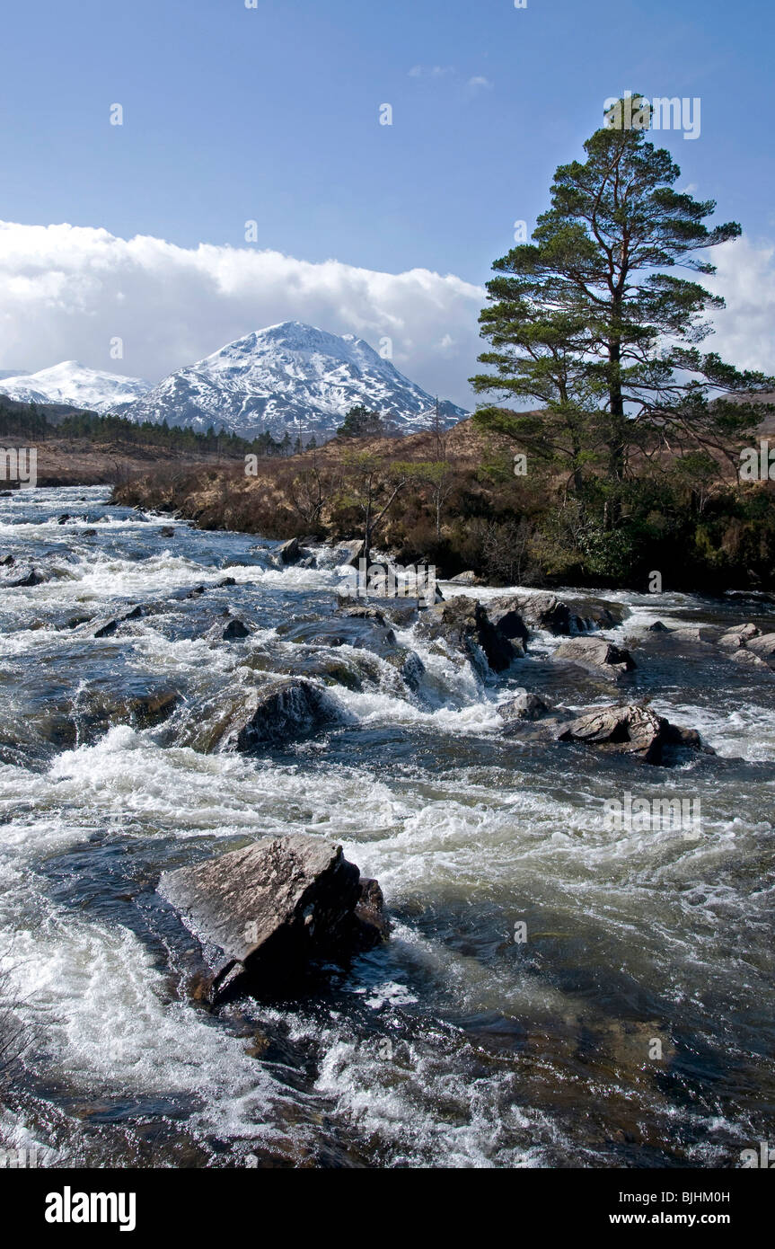 Highland Burn rushes past the mountains of Torridon Stock Photo - Alamy