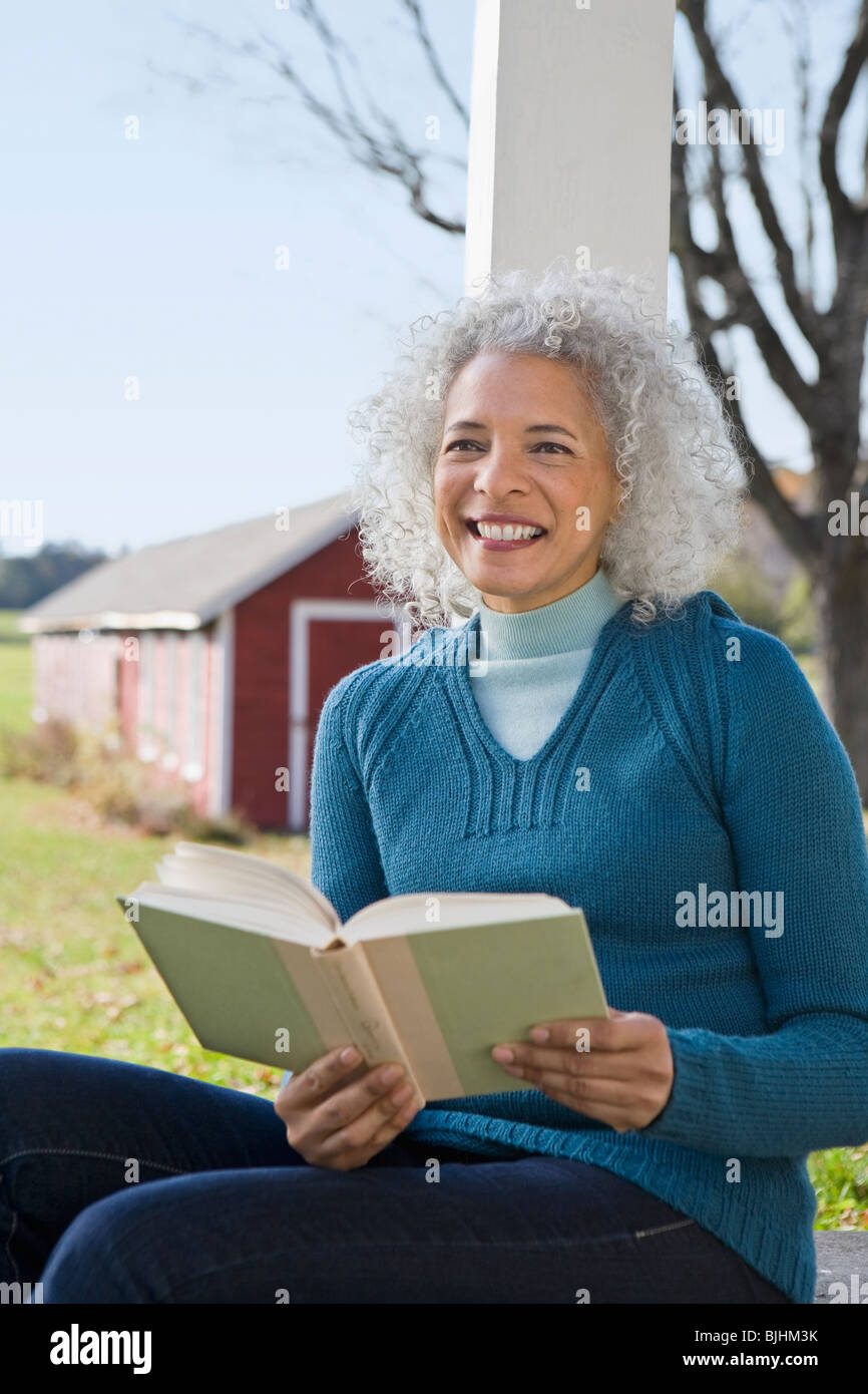 Woman reading a book Stock Photo - Alamy