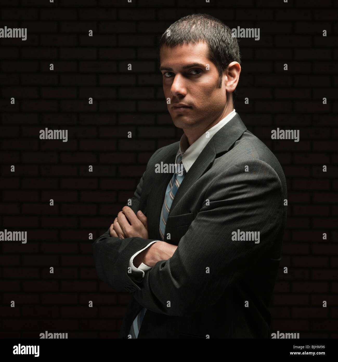 businessman with his arms folded Stock Photo - Alamy