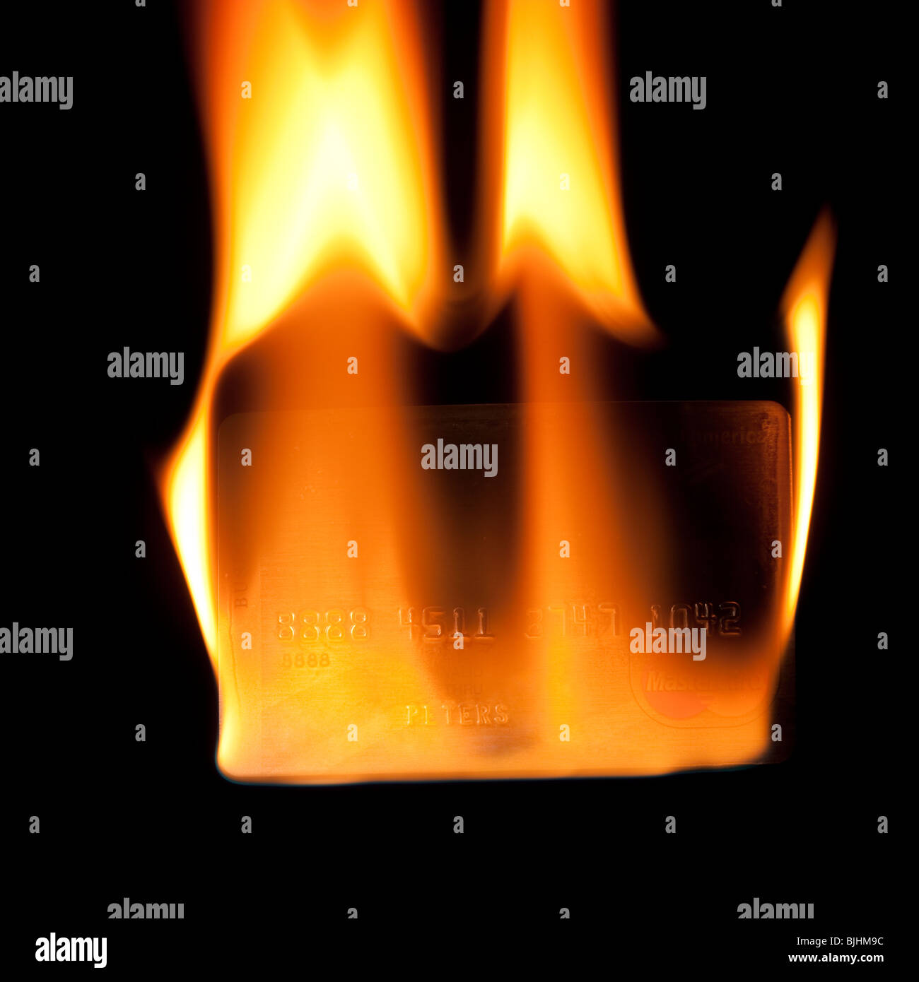 credit card on fire Stock Photo - Alamy