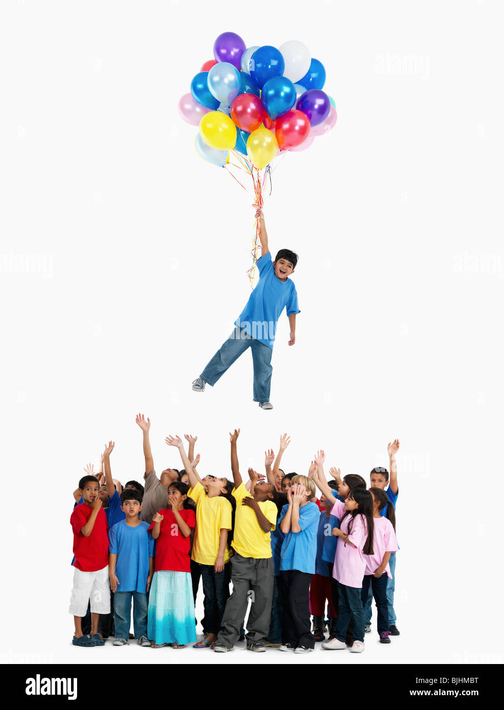 Boy floating away with balloons Stock Photo - Alamy