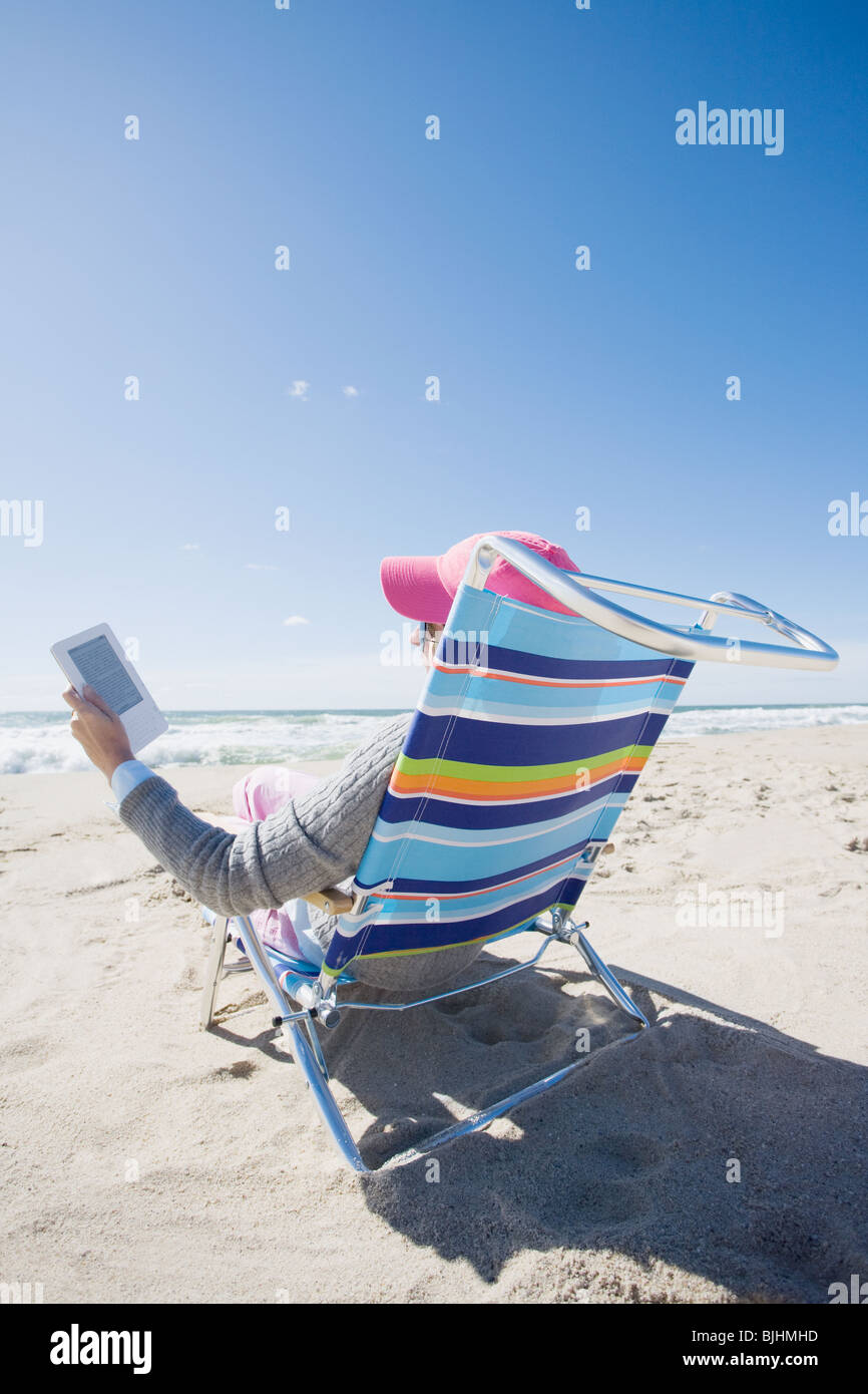 Reading at the beach Stock Photo - Alamy