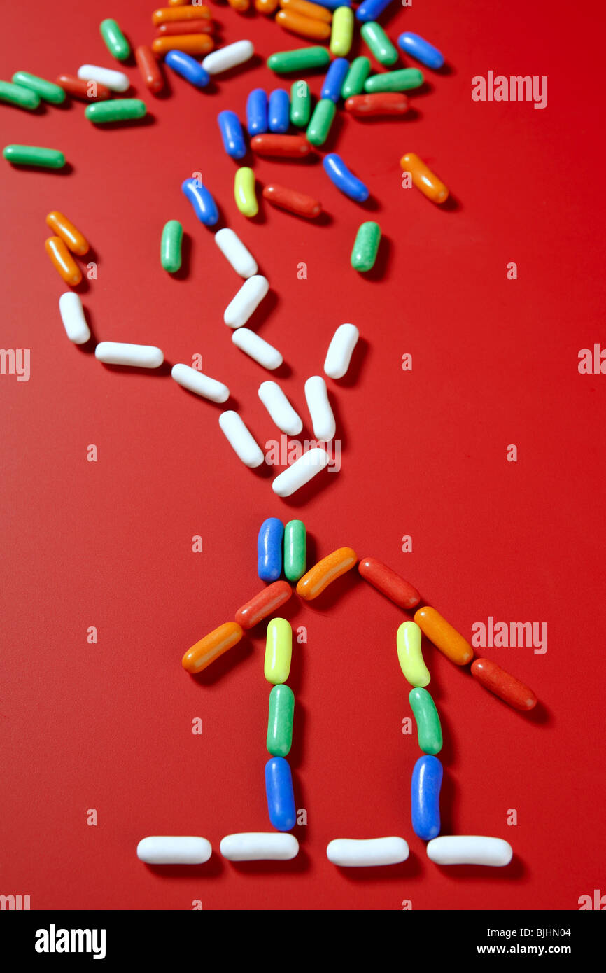 House mortgage metaphor, draw with candy over red Stock Photo - Alamy