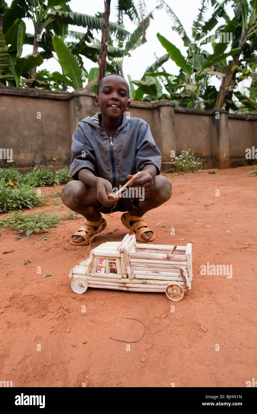 Rwandan boy with home made toy wagon Stock Photo - Alamy