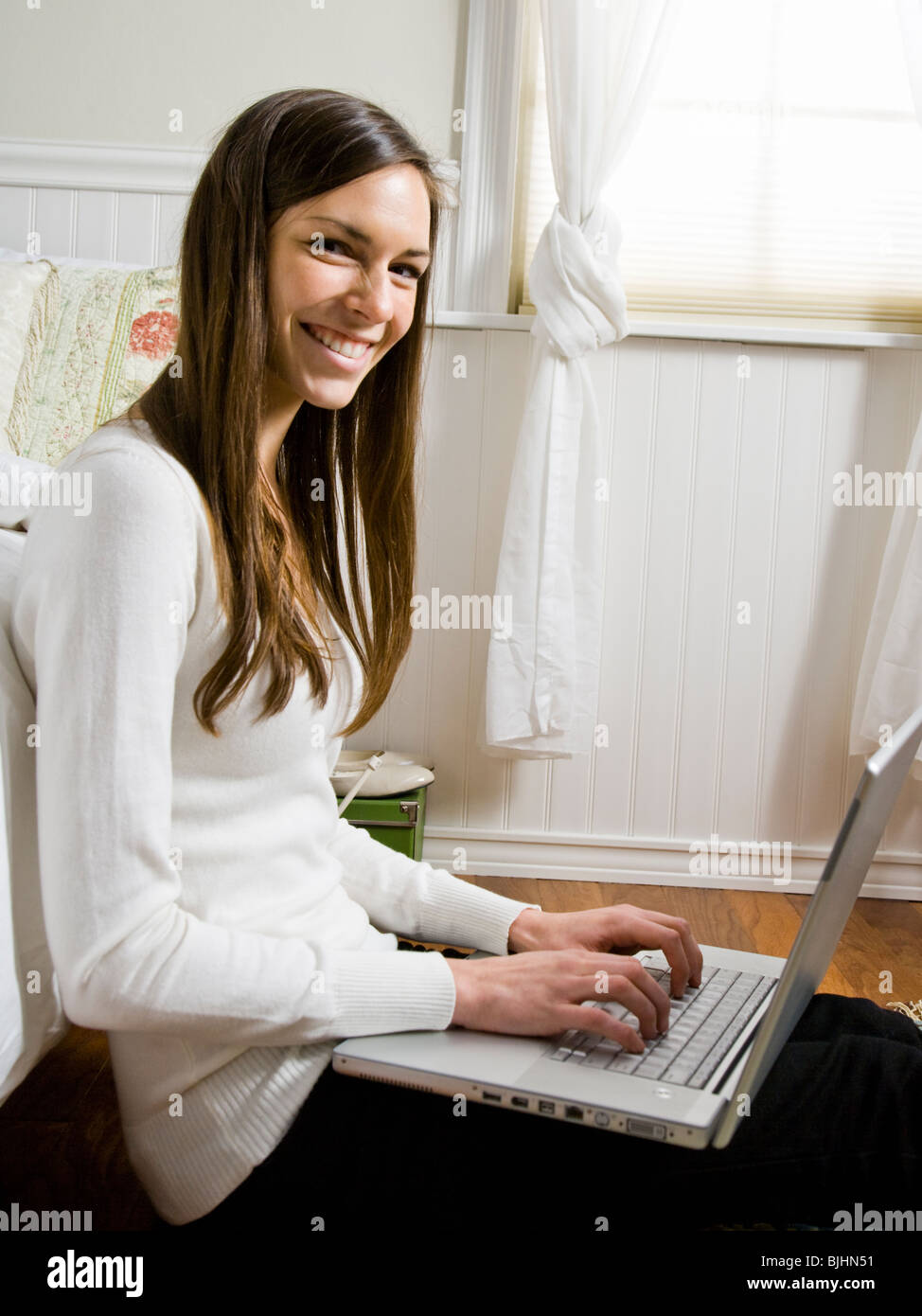 girl using a laptop Stock Photo - Alamy