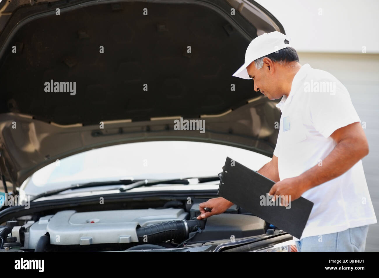 Checking car engine Stock Photo - Alamy