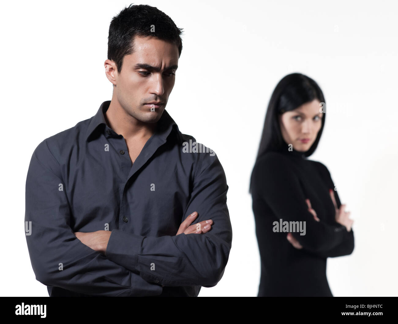 young couple on white background having a dispute Stock Photo - Alamy