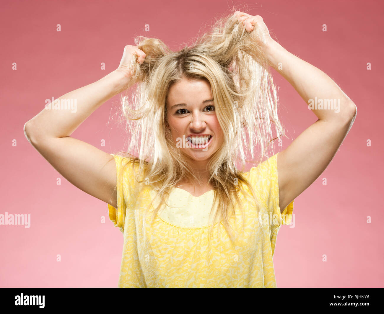 One woman angry pulling hair hi-res stock photography and images - Alamy
