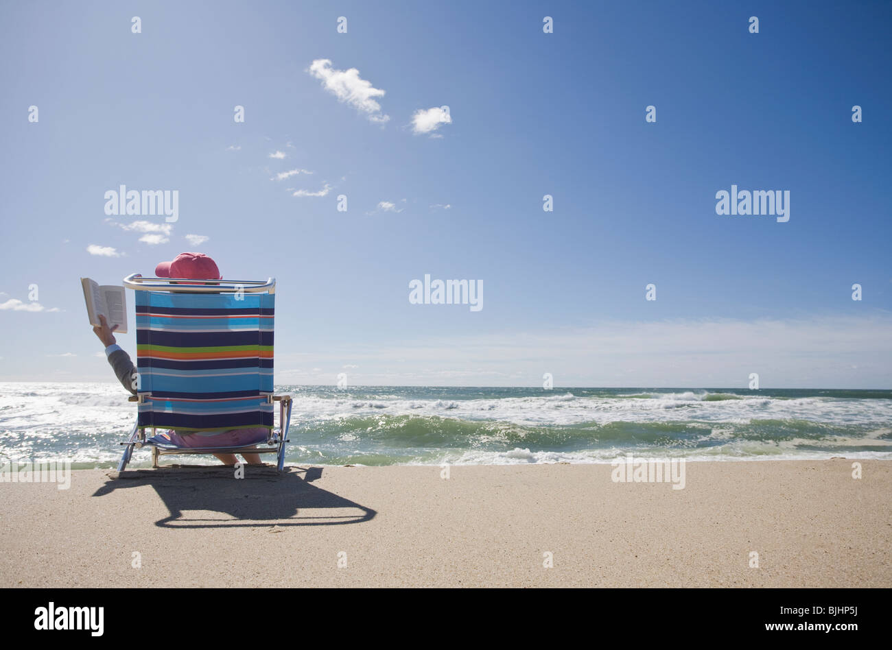 Reading at the beach Stock Photo - Alamy