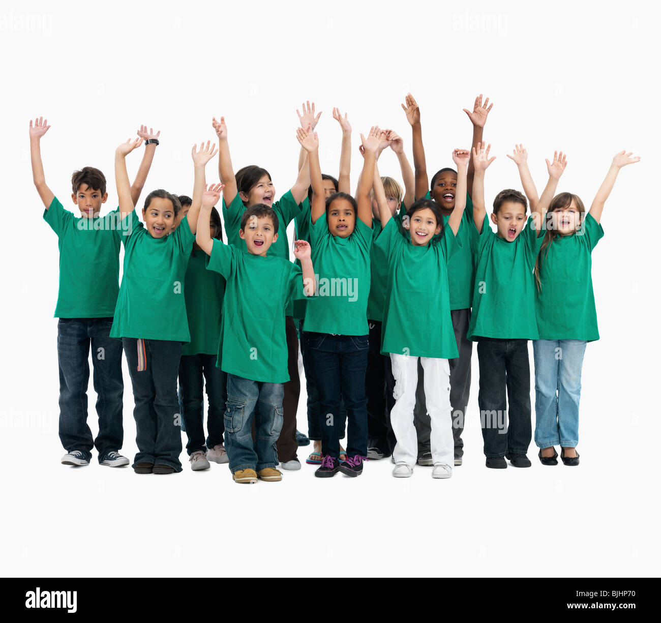 Group of children with their arms raised Stock Photo - Alamy