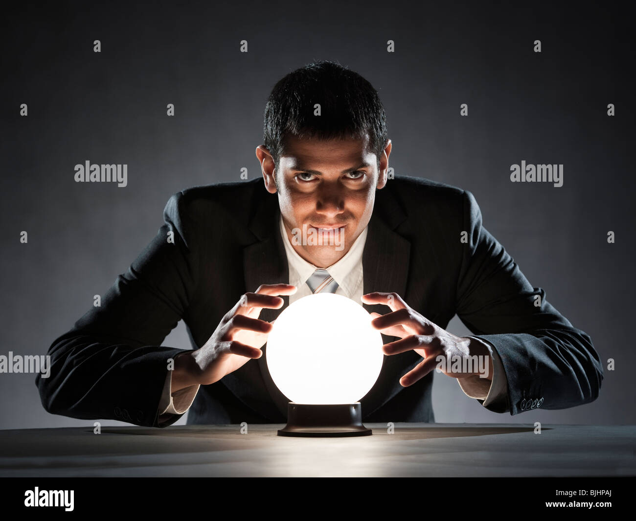 businessman with a crystal ball Stock Photo - Alamy