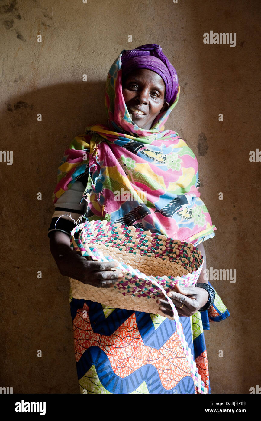 Rwandan Muslim lady with weaved basket she has made to sell. Rwanda ...