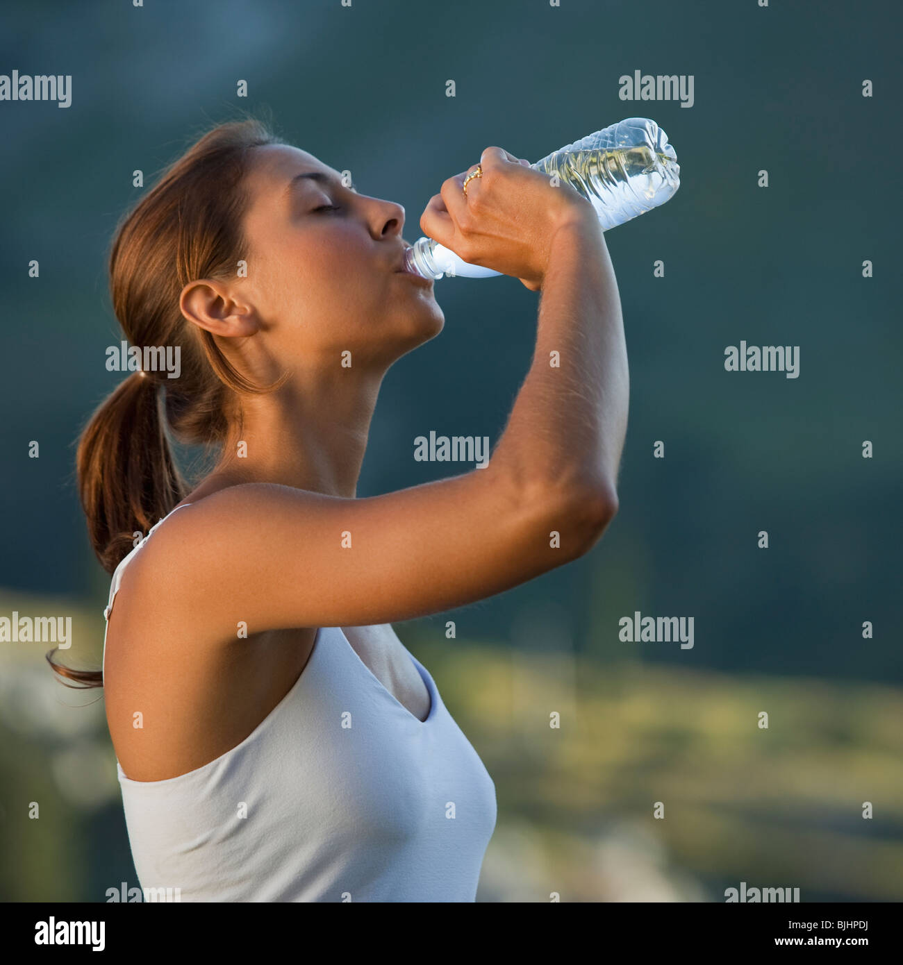 Woman drinking water Stock Photo - Alamy