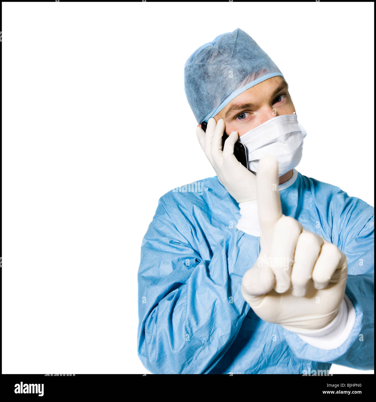 doctor on his cell phone in the middle of a procedure Stock Photo - Alamy