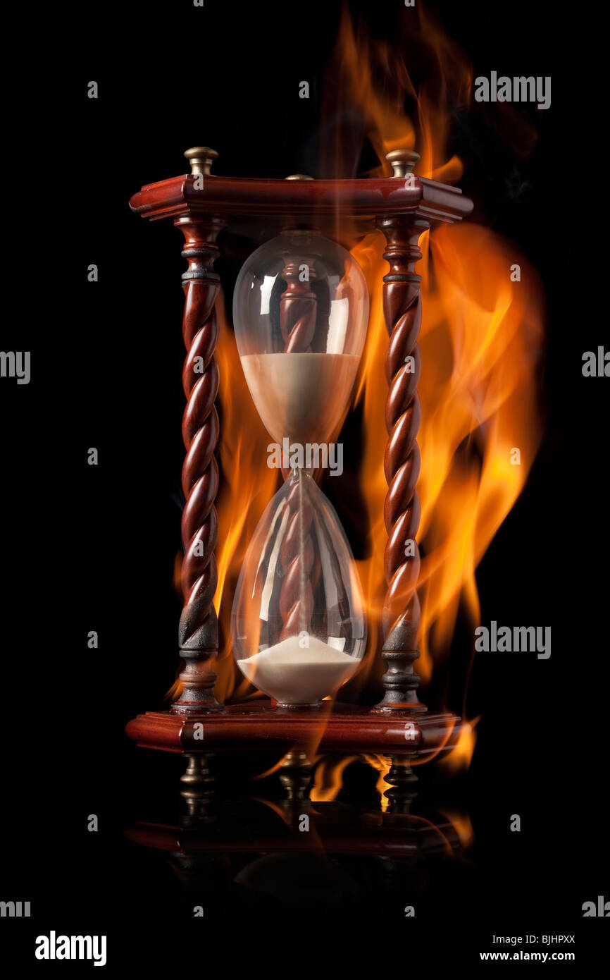 hourglass on fire Stock Photo - Alamy