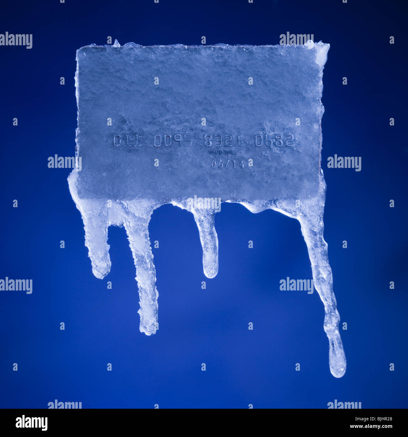Credit card covered in ice Stock Photo - Alamy