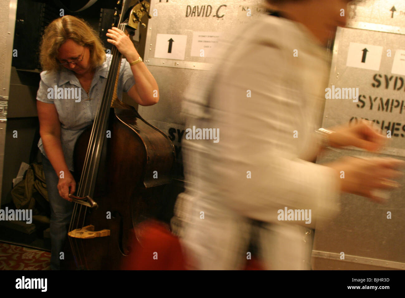 Members of the Sydney Symphony Orchestra prepare backstage for a music ...