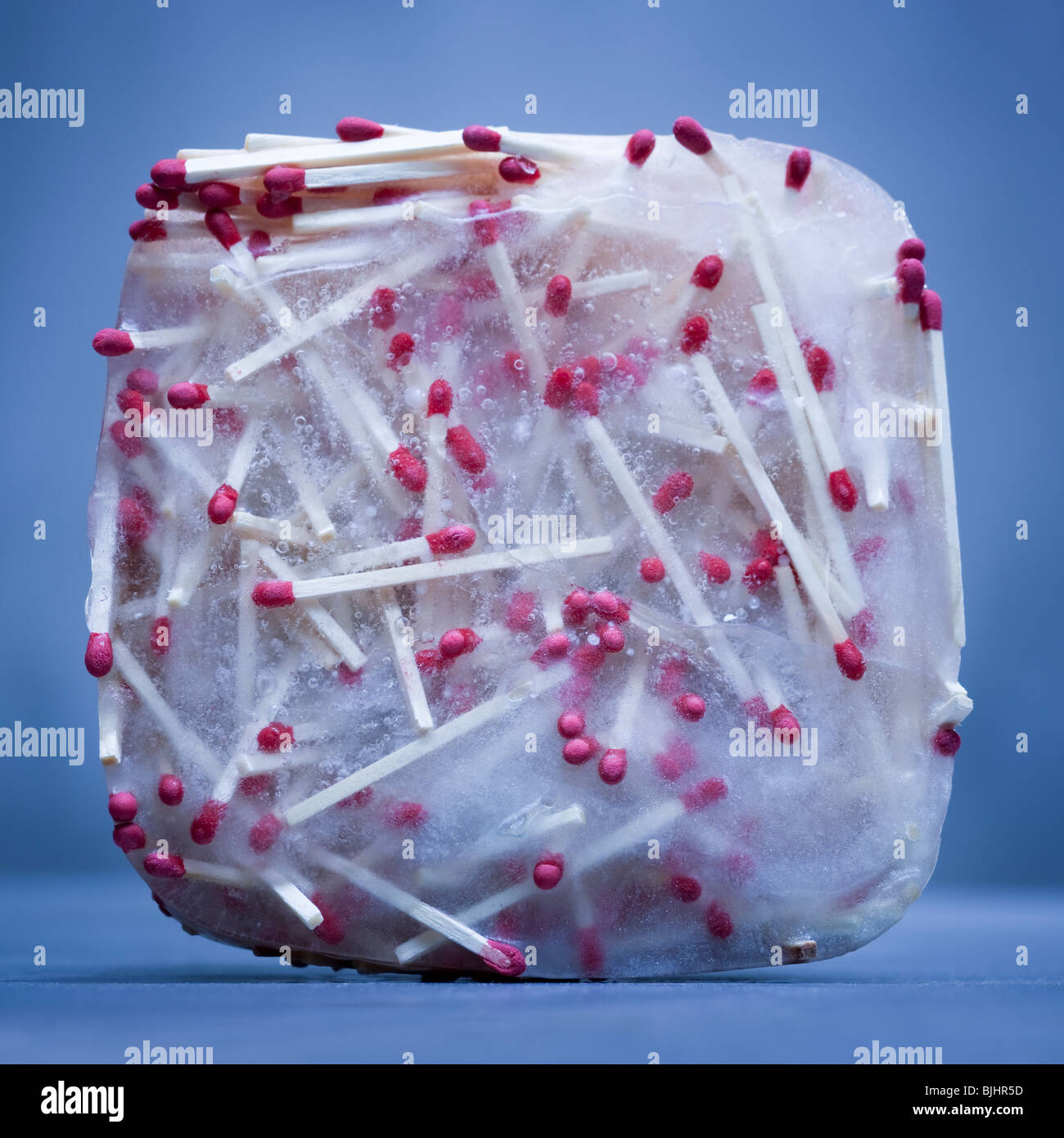 matches frozen in a block of ice Stock Photo - Alamy